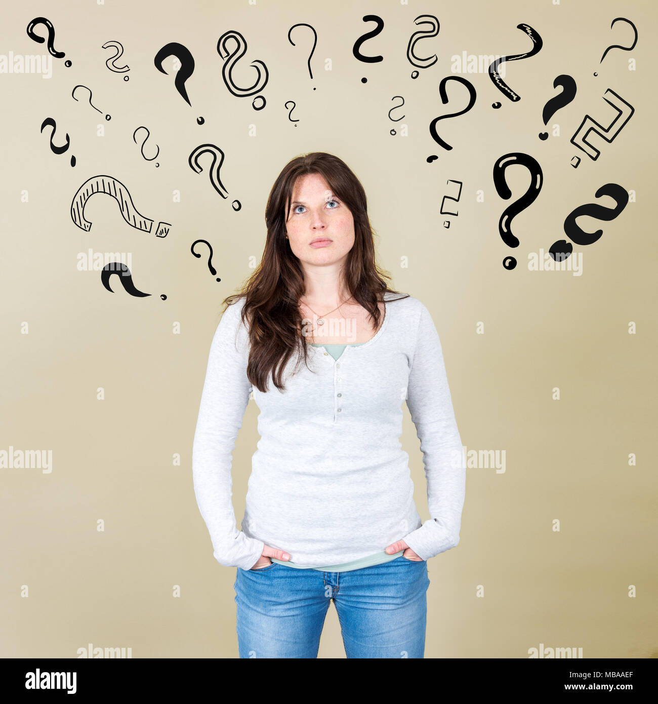 Concept of preoccupied and thoughtful woman with hands in pockets being ...