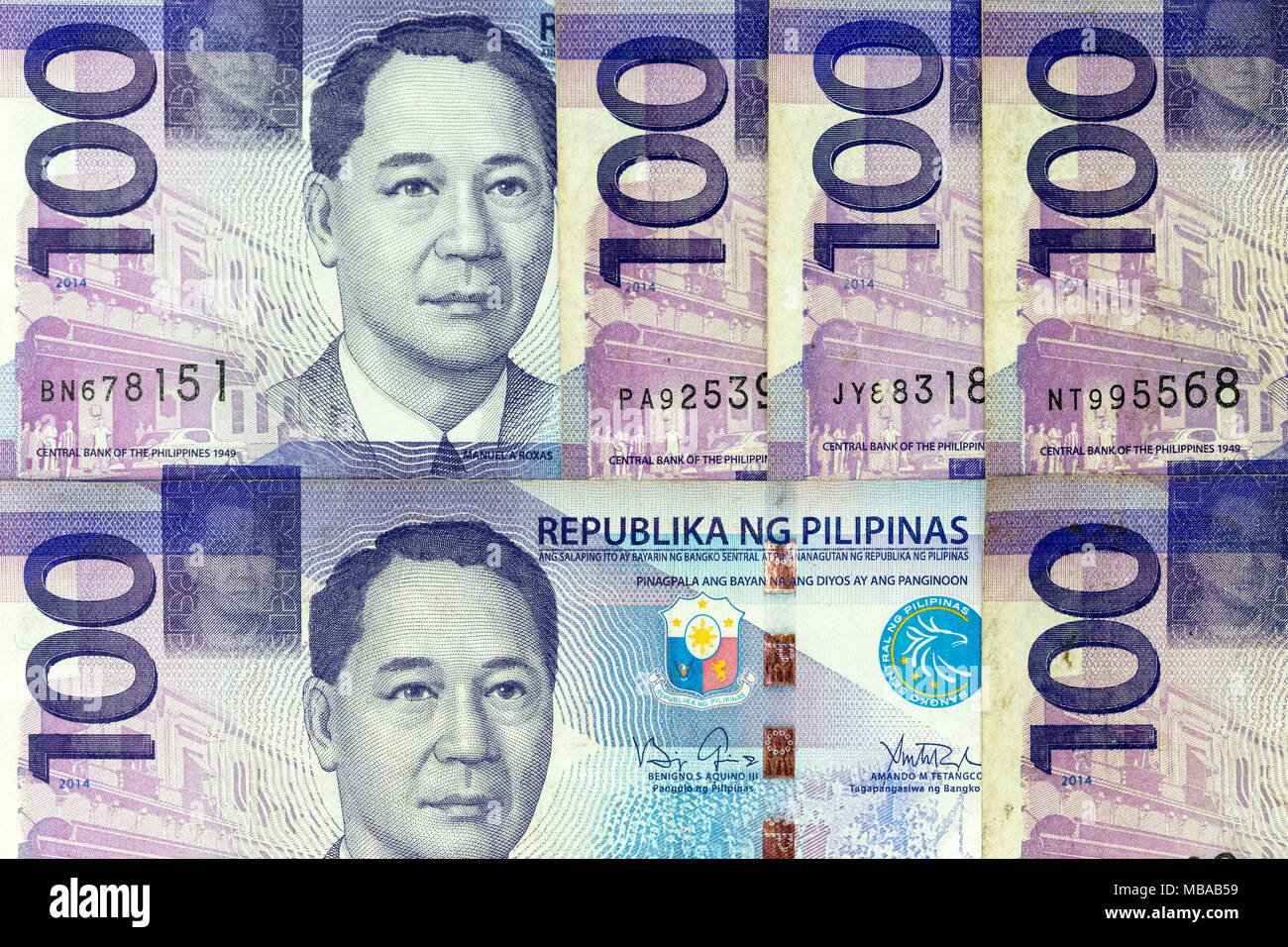 Currency banknotes spread across frame philippines peso in various ...