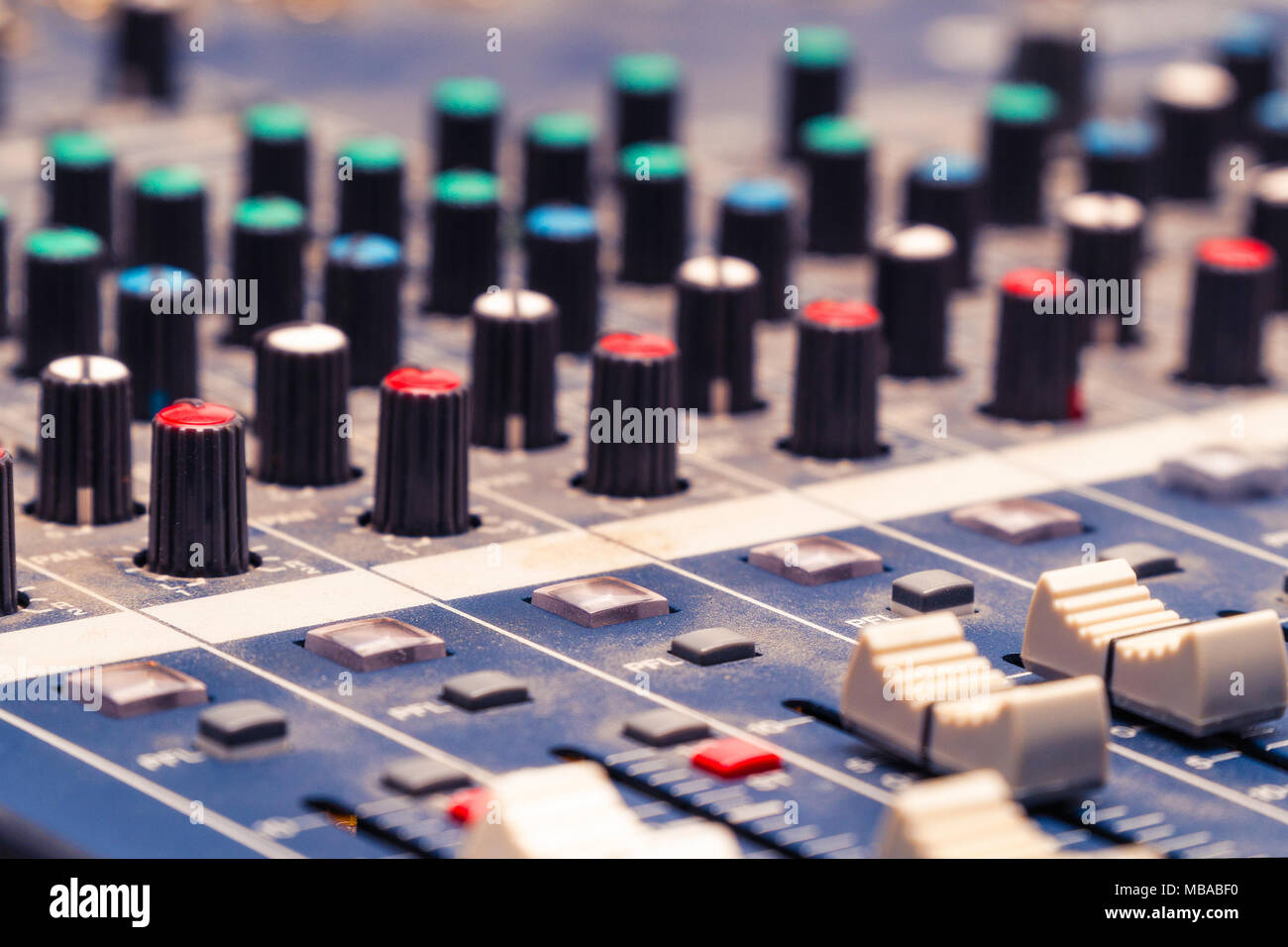 View of the mixing console in the Studio. Buttons, faders and sliders ...