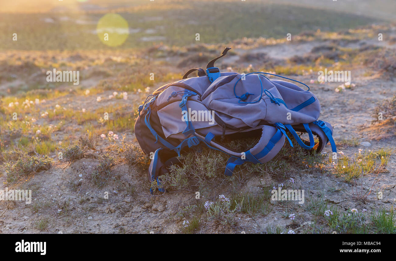 Professional hiking backpack lying on the ground Stock Photo - Alamy