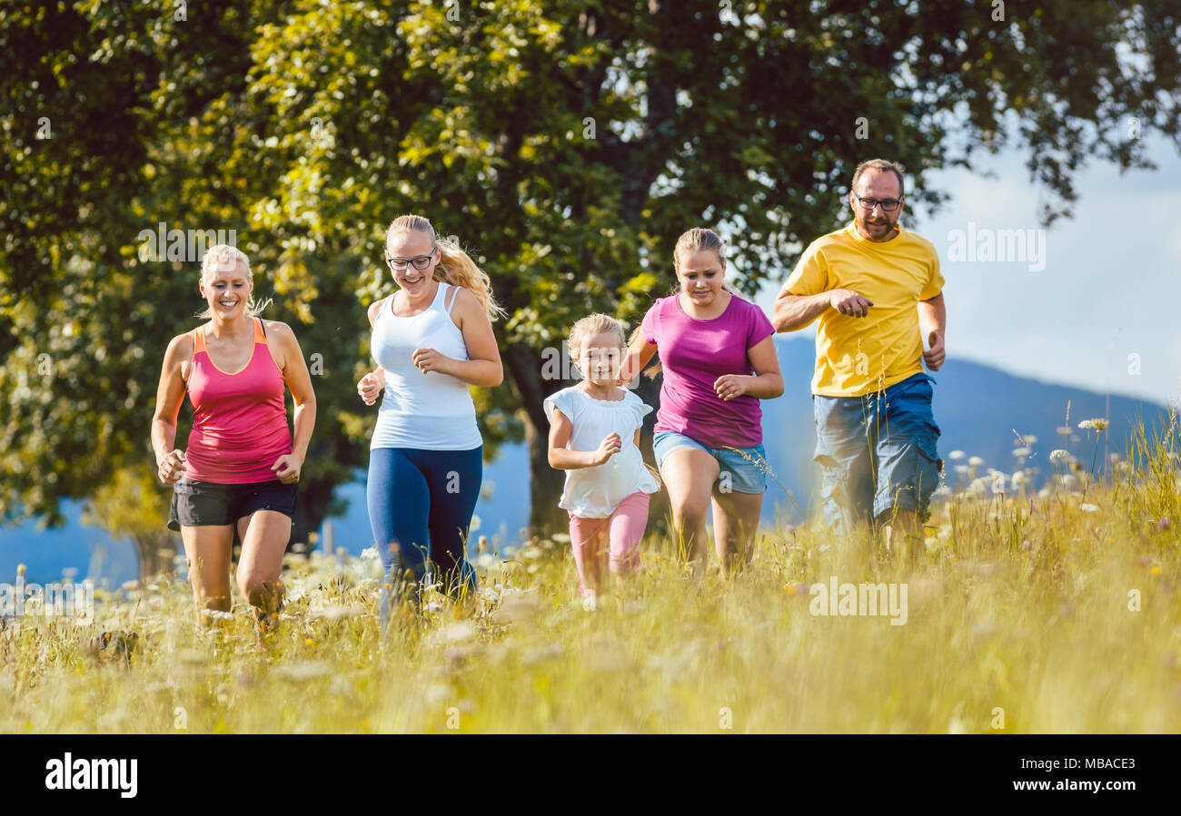 Family, mother, father and kids running for sport Stock Photo - Alamy