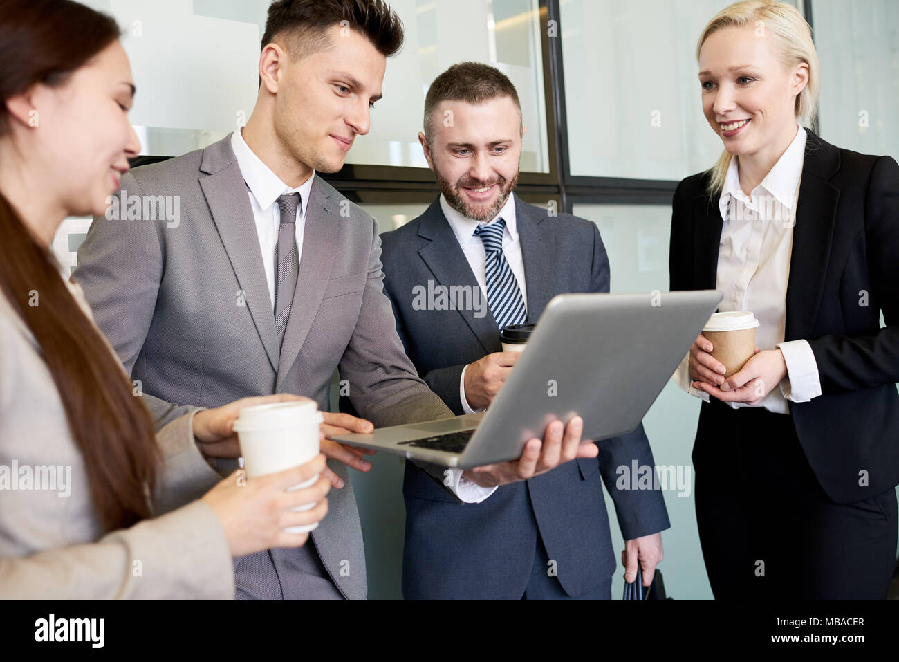 Business Team Using Laptop Stock Photo - Alamy