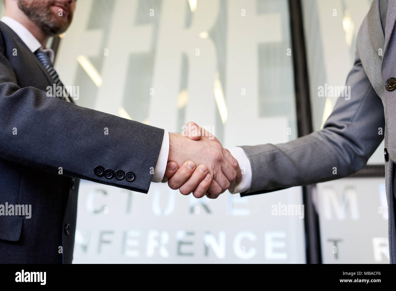 Two Business People Shaking Hands Stock Photo - Alamy