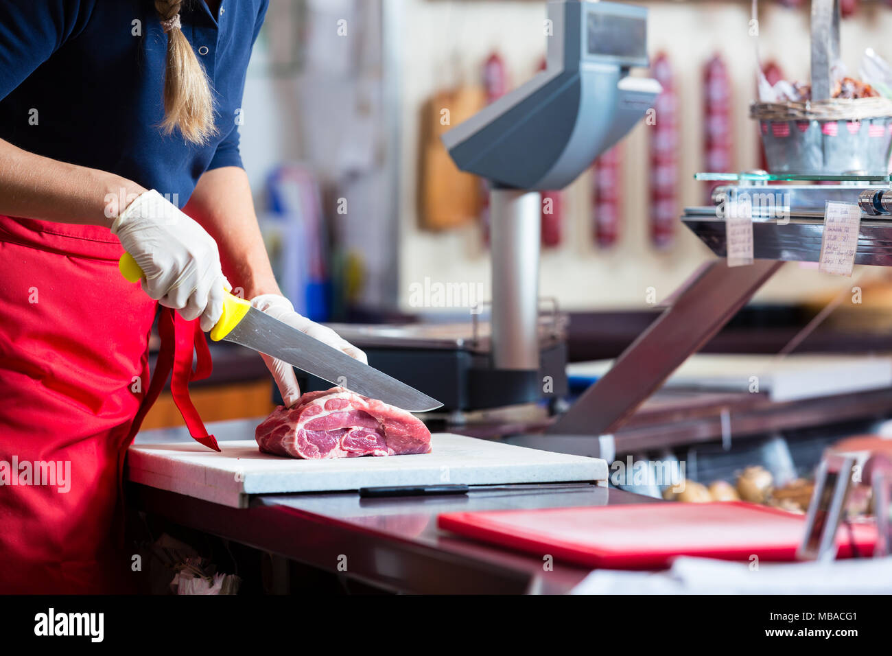 Butcher shop saleswoman showing hi-res stock photography and images - Alamy