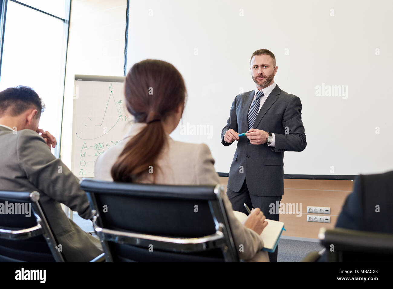 Mature Businessman Giving Presentation Stock Photo - Alamy