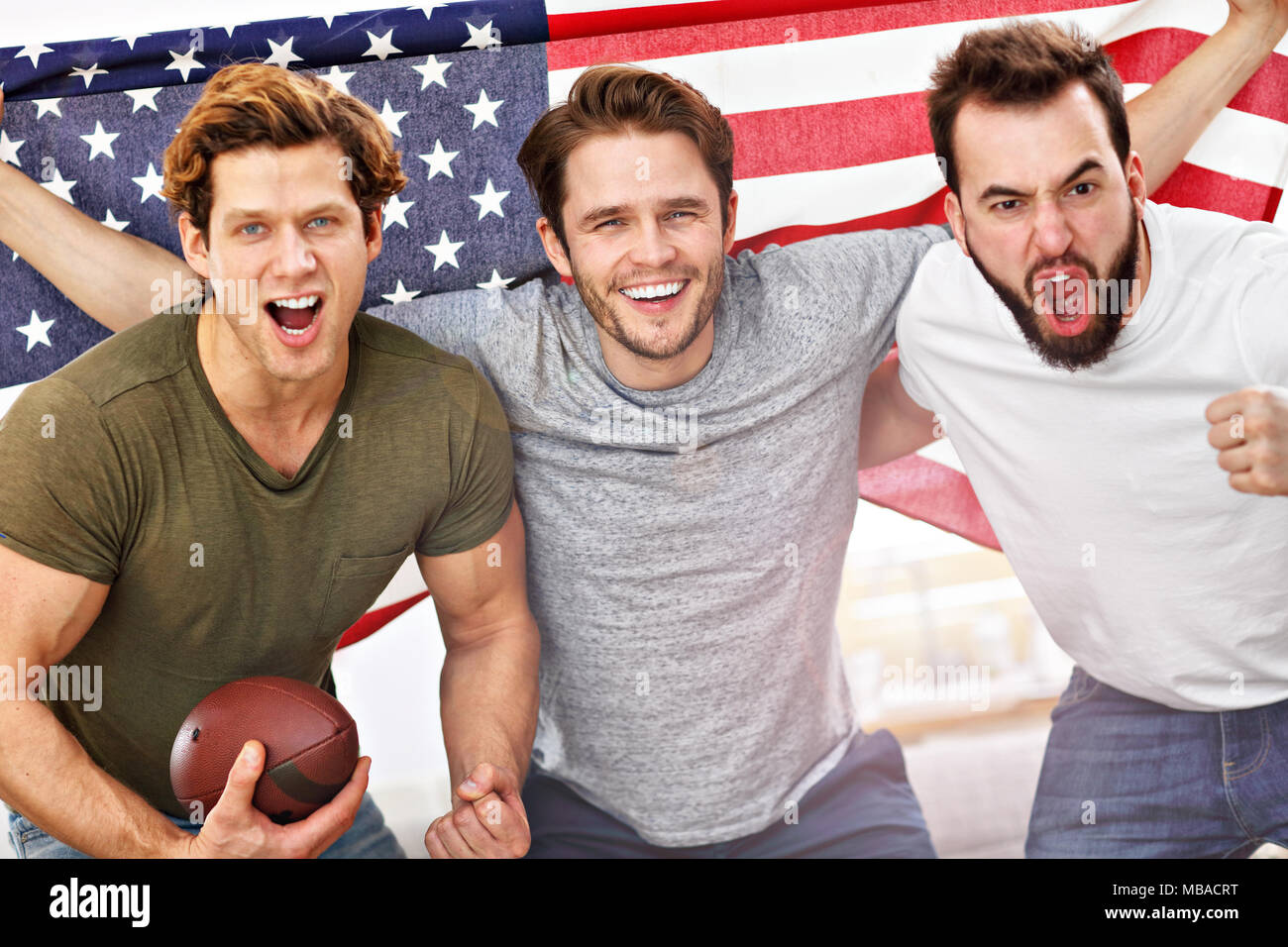Happy american football fans Stock Photo - Alamy