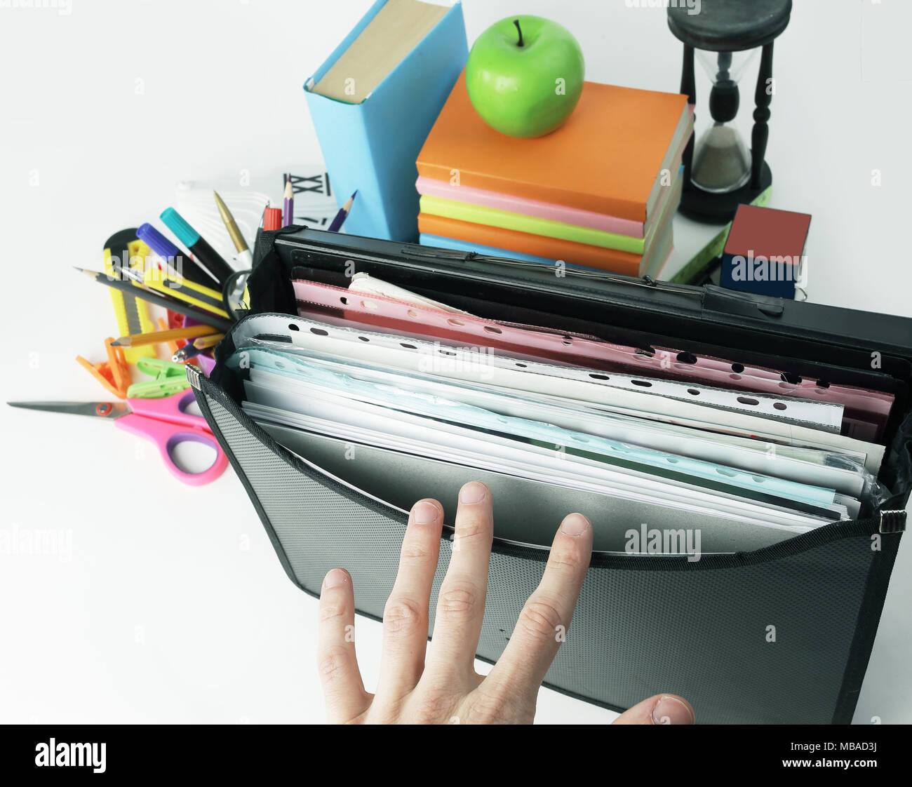 close up. briefcase with file folders and school supplies on white ...