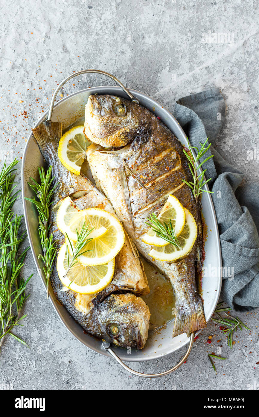 Baked fish dorado. Sea bream or dorada fish grilled Stock Photo - Alamy