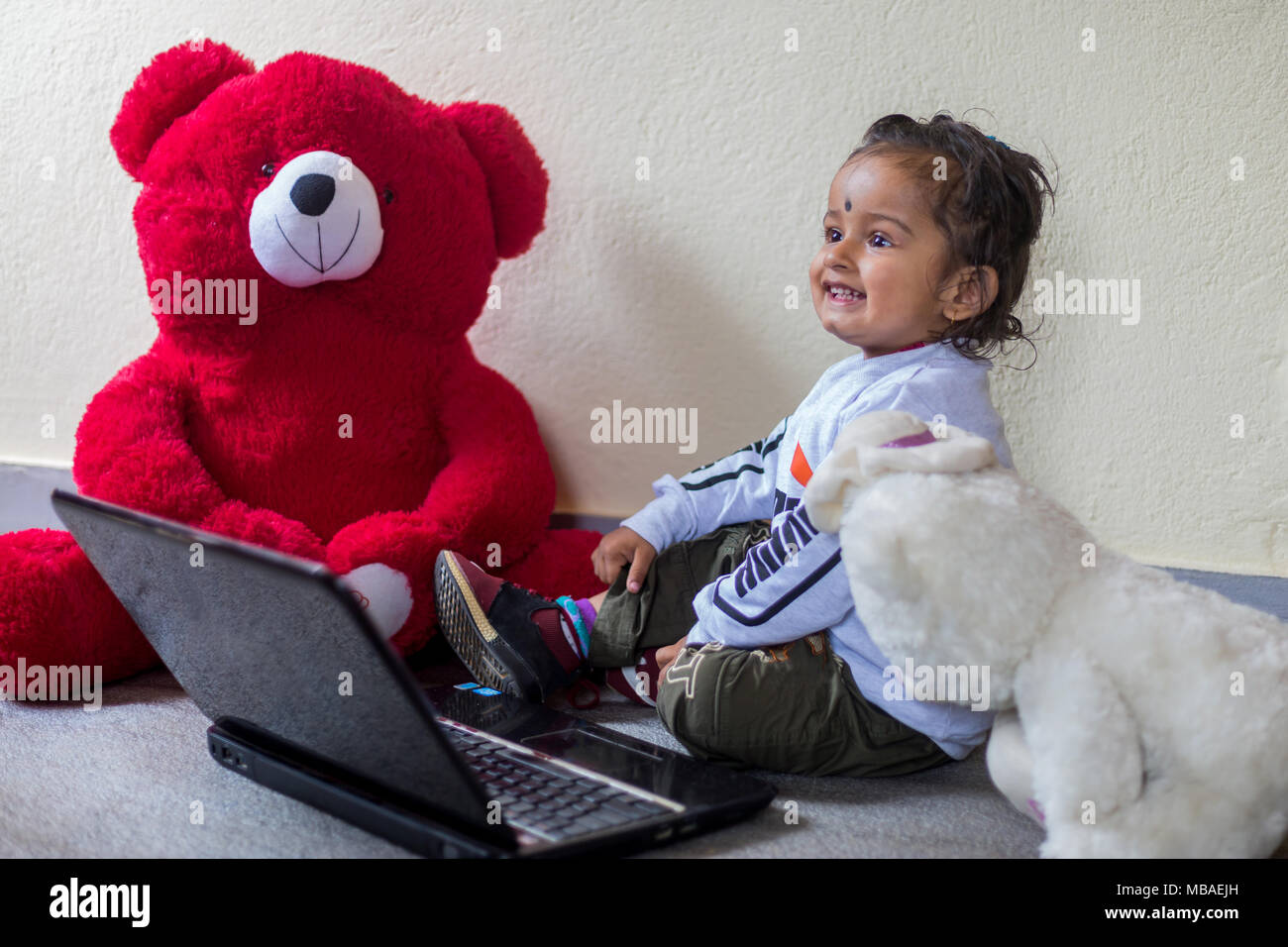 Baby Child Playing,laying on the Floor and Using a Laptop Computer ...