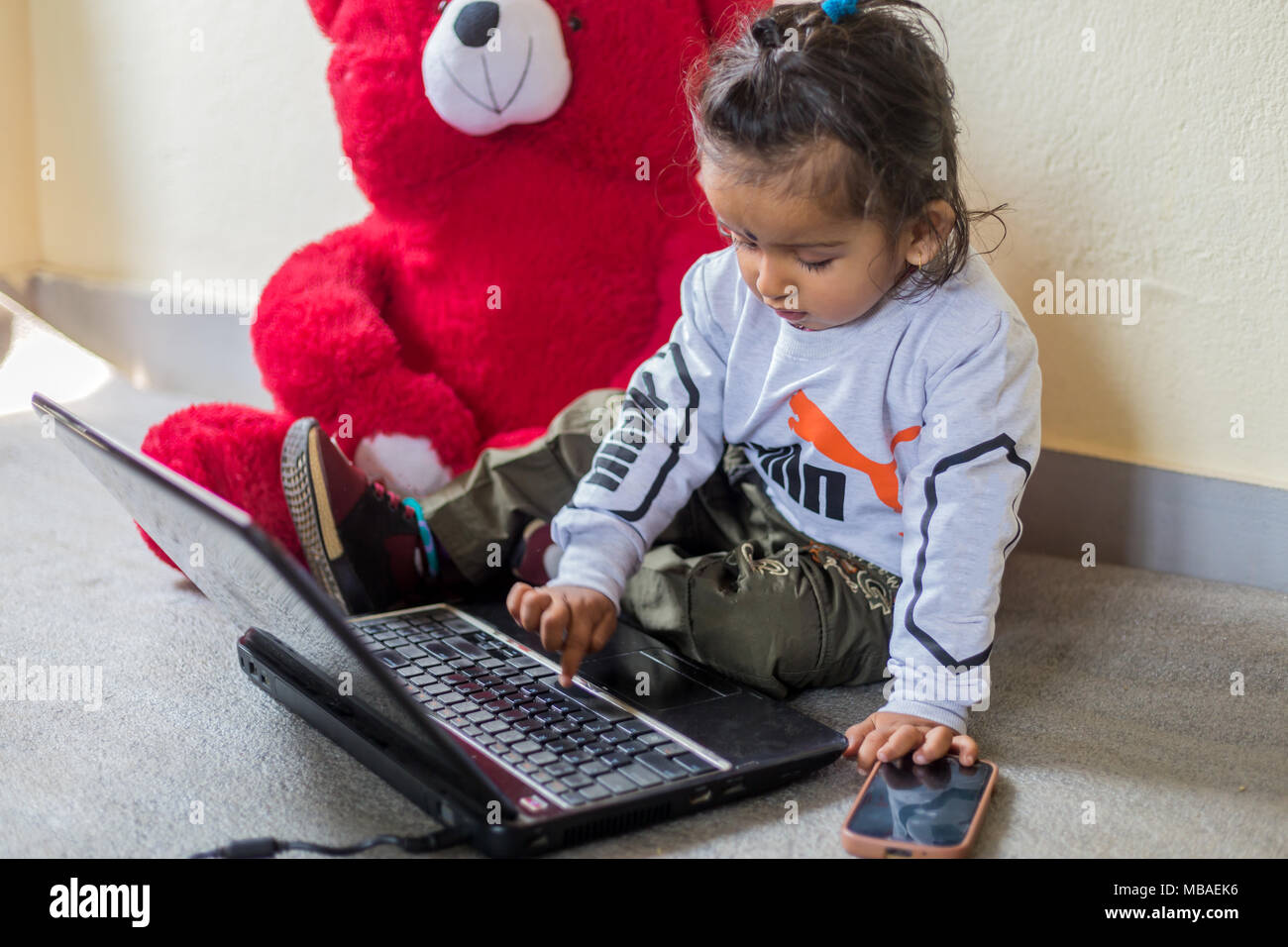 Baby Child Playing,laying on the Floor and Using a Laptop Computer ...