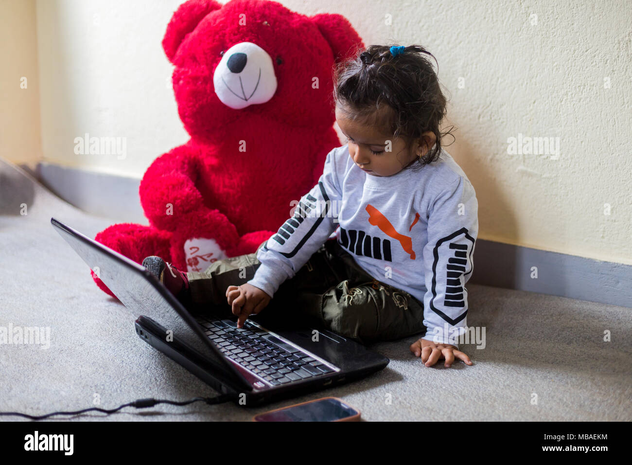 Baby Child Playing,laying on the Floor and Using a Laptop Computer ...