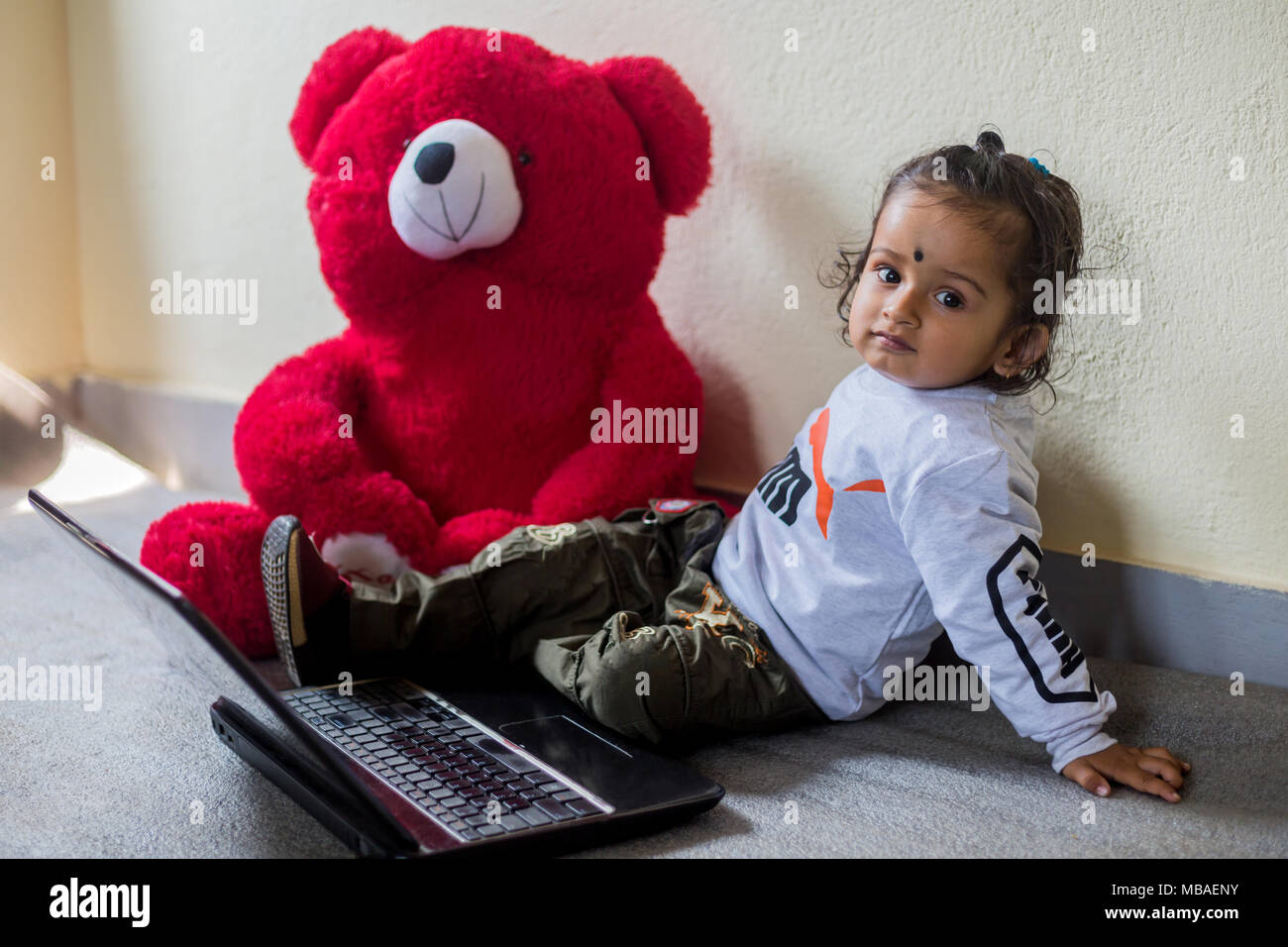 Baby Child Playing,laying on the Floor and Using a Laptop Computer ...