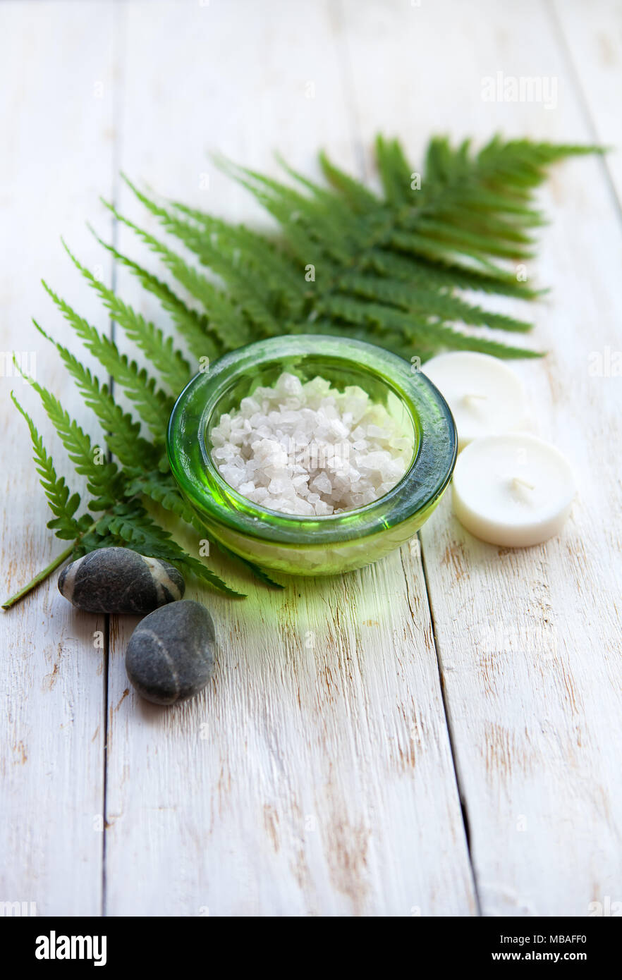 Spa Setting Sea Salt with Fern on white wooden background Spa resort ...