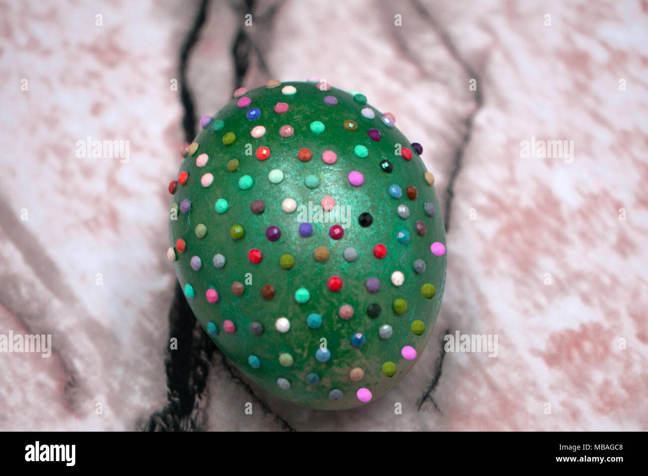 happy easter egg Egg decorated with thread and white beads in lines ...