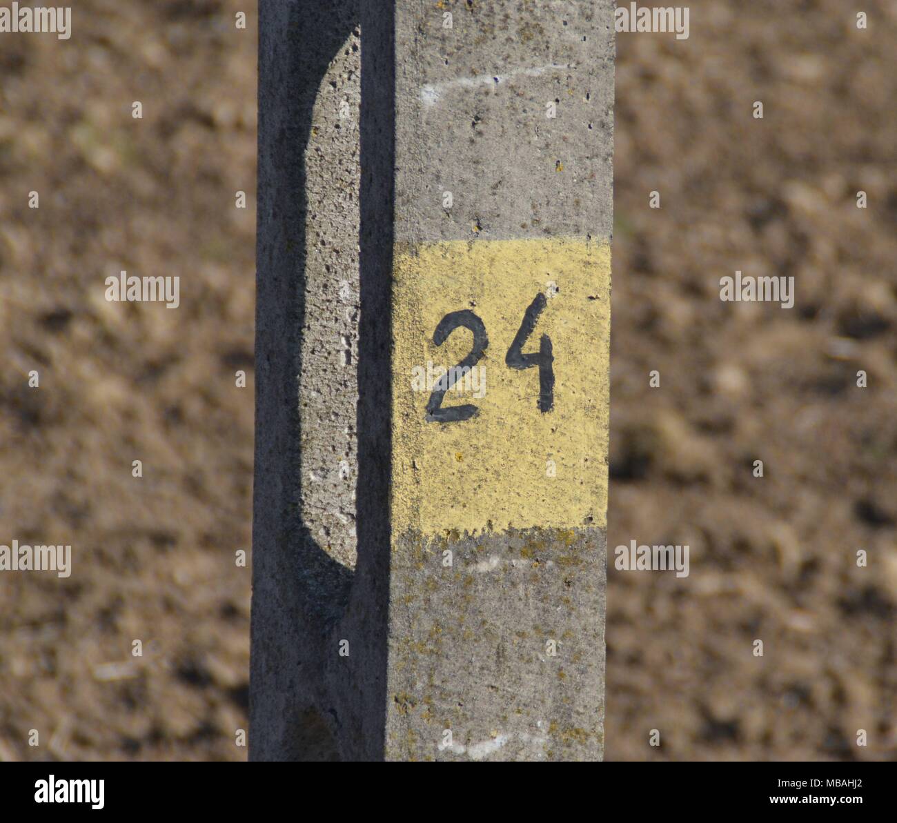 Concrete pole with number 24 Stock Photo - Alamy