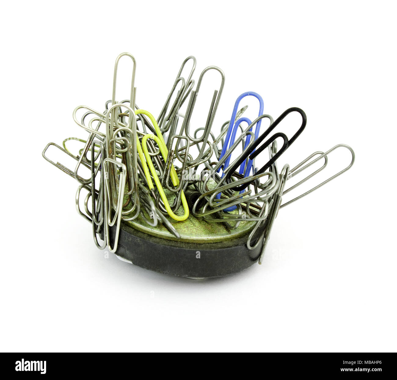 Paper clips and magnet is isolated on a white Stock Photo - Alamy