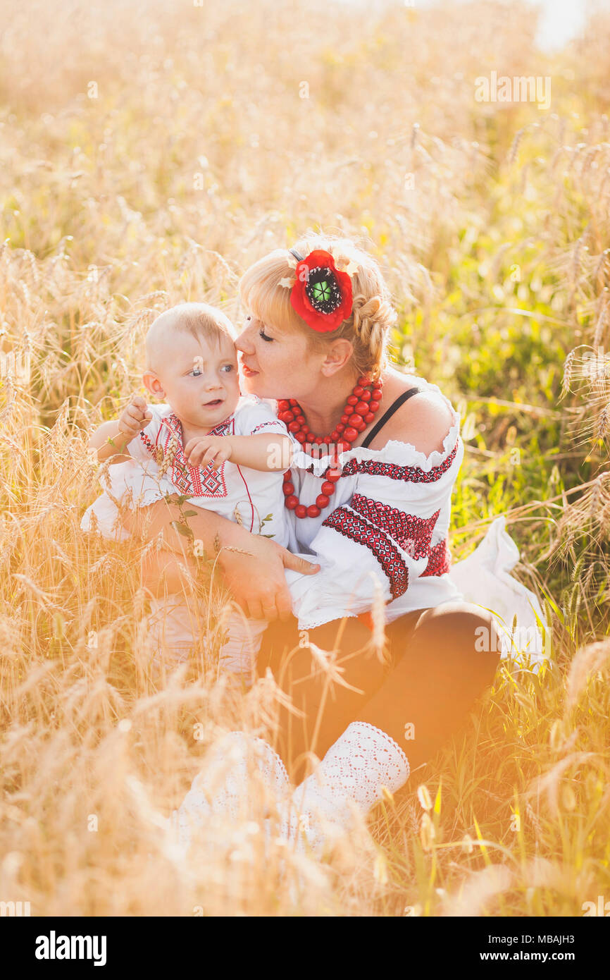 Portrait of ethnic ukrainian family wearing traditional white clothes ...