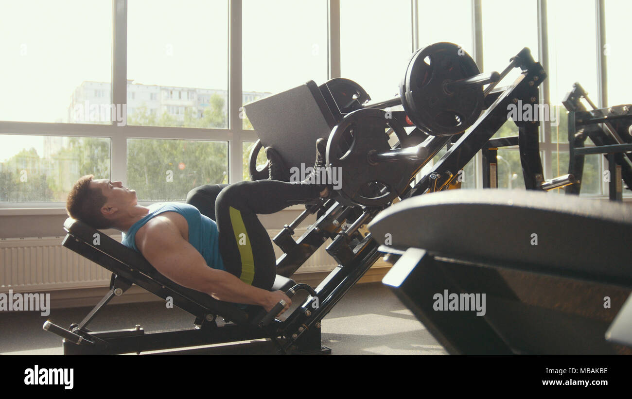 Strong man powerlifter on the strength training in a gym Stock Photo ...