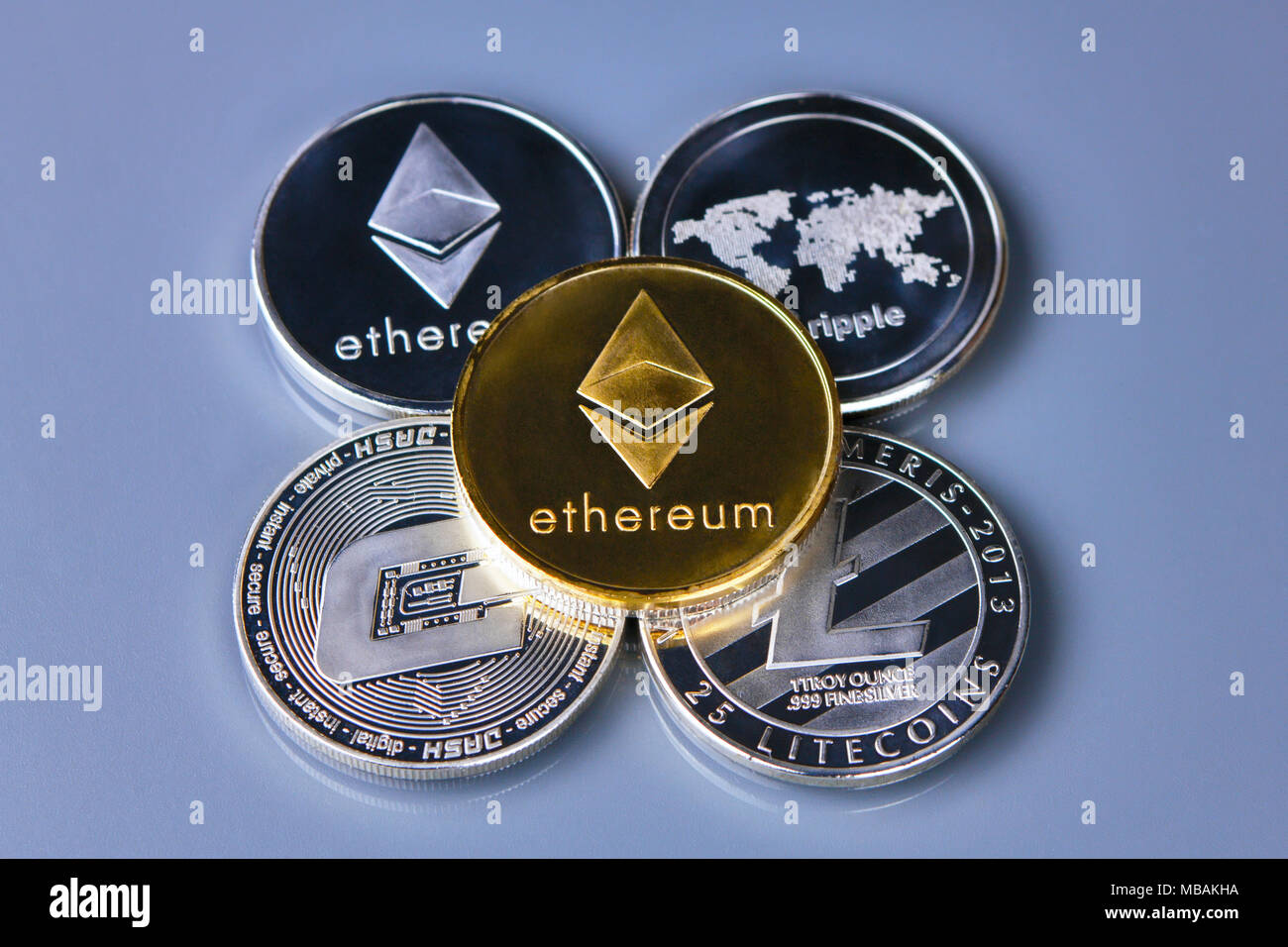 Stack of ether coins or ethereum on gold background Stock Photo - Alamy