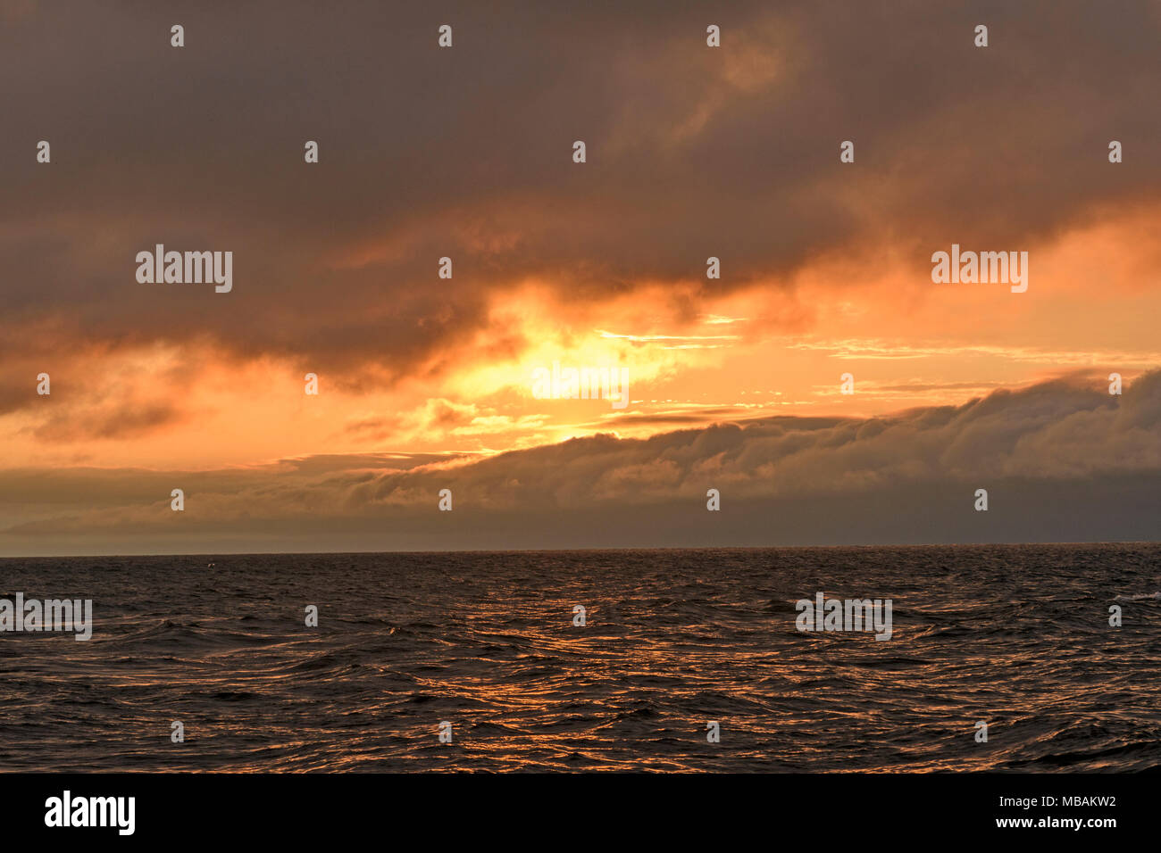 Sun Peeking Through the Clouds over Waves on Lake Superior in Porcupine ...