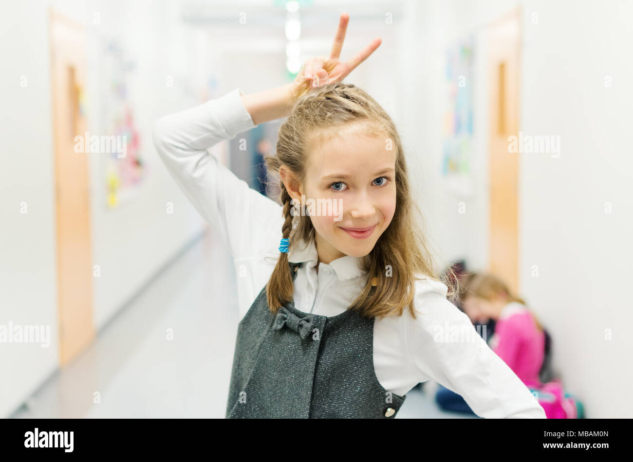 Funny cute girl at break time in school Stock Photo - Alamy
