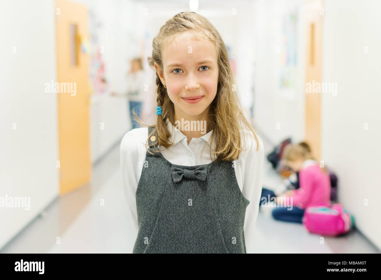 Smiling cute girl at break time in school Stock Photo - Alamy