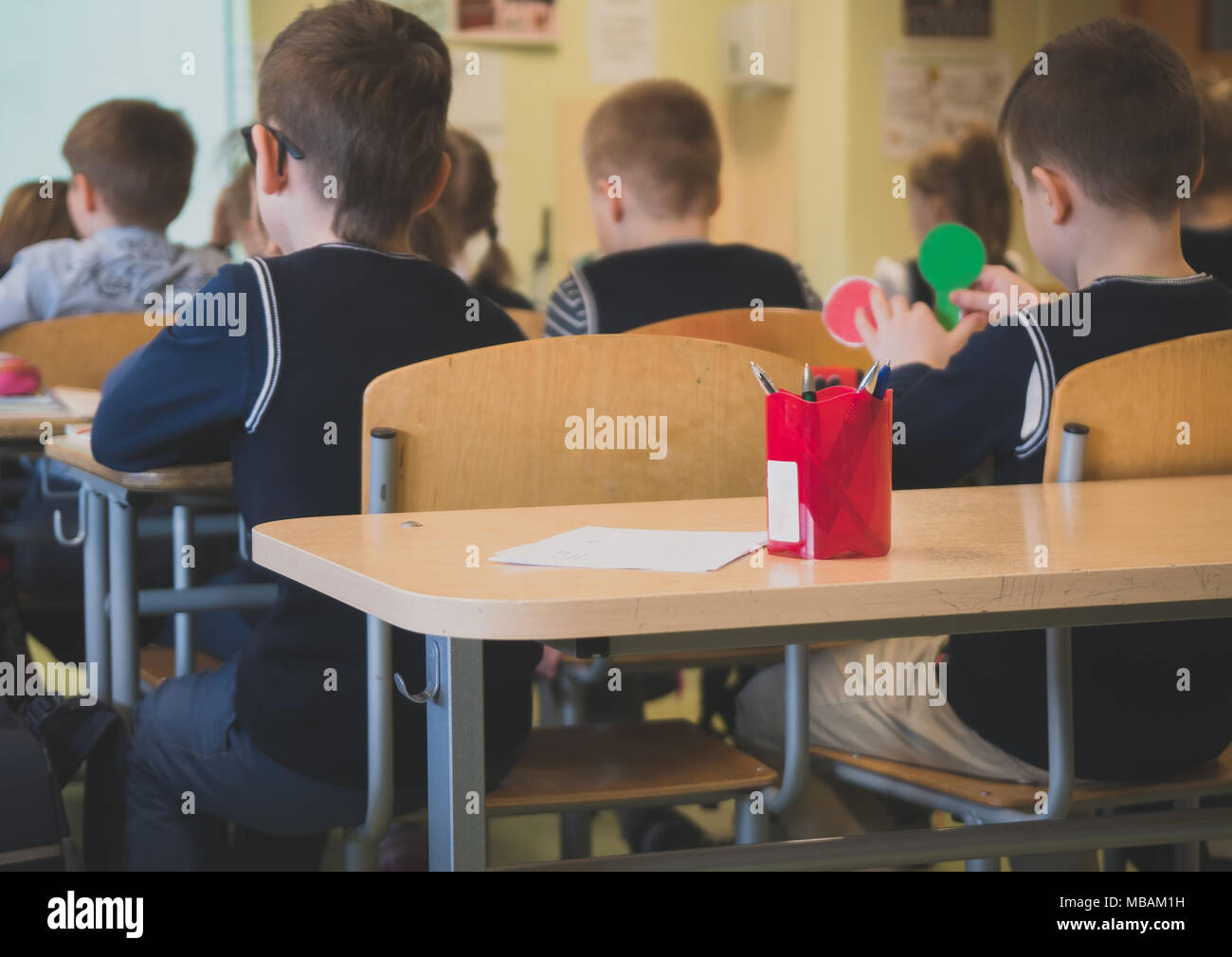 Children in class at school. Back view Stock Photo - Alamy