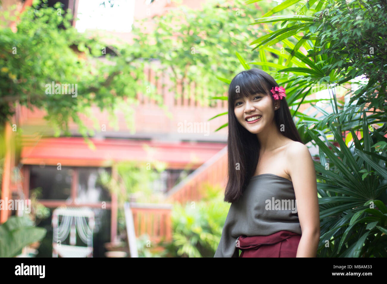 Nice and beautiful smiling Thai girl with Thai ancient style dressing ...