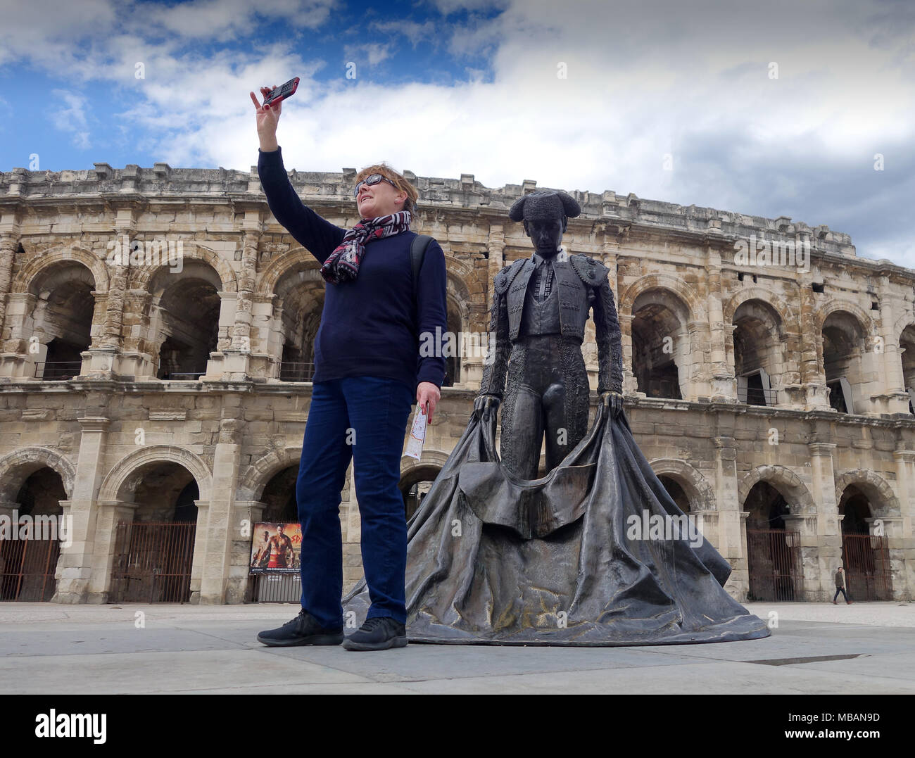 Nimes, France 2018 Tourist taking a selfie atRoman Amphitheatre or ...