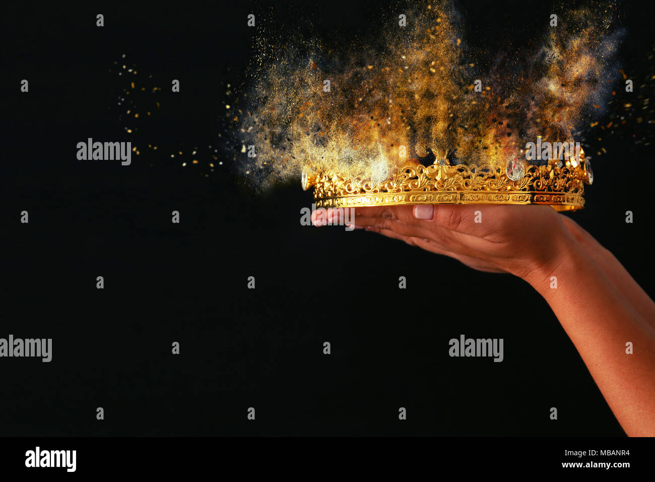 Woman's hand holding a crown for show victory or winning first place ...