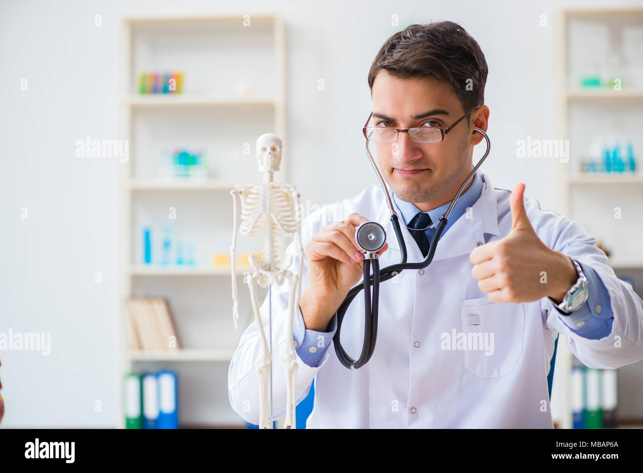 Doctor student studying the bones of skeleton Stock Photo - Alamy