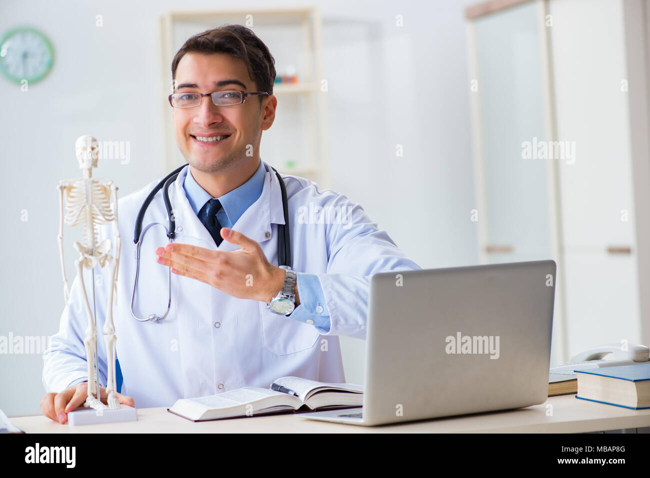 Doctor student studying the bones of skeleton Stock Photo - Alamy