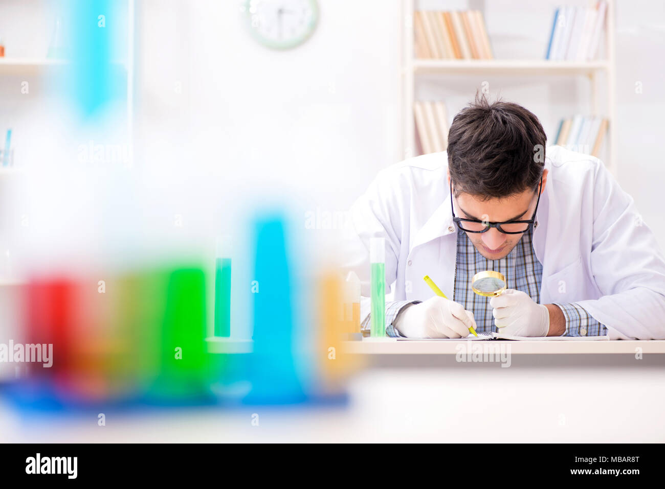 Chemistry student doing chemical experiments at classroom activity ...