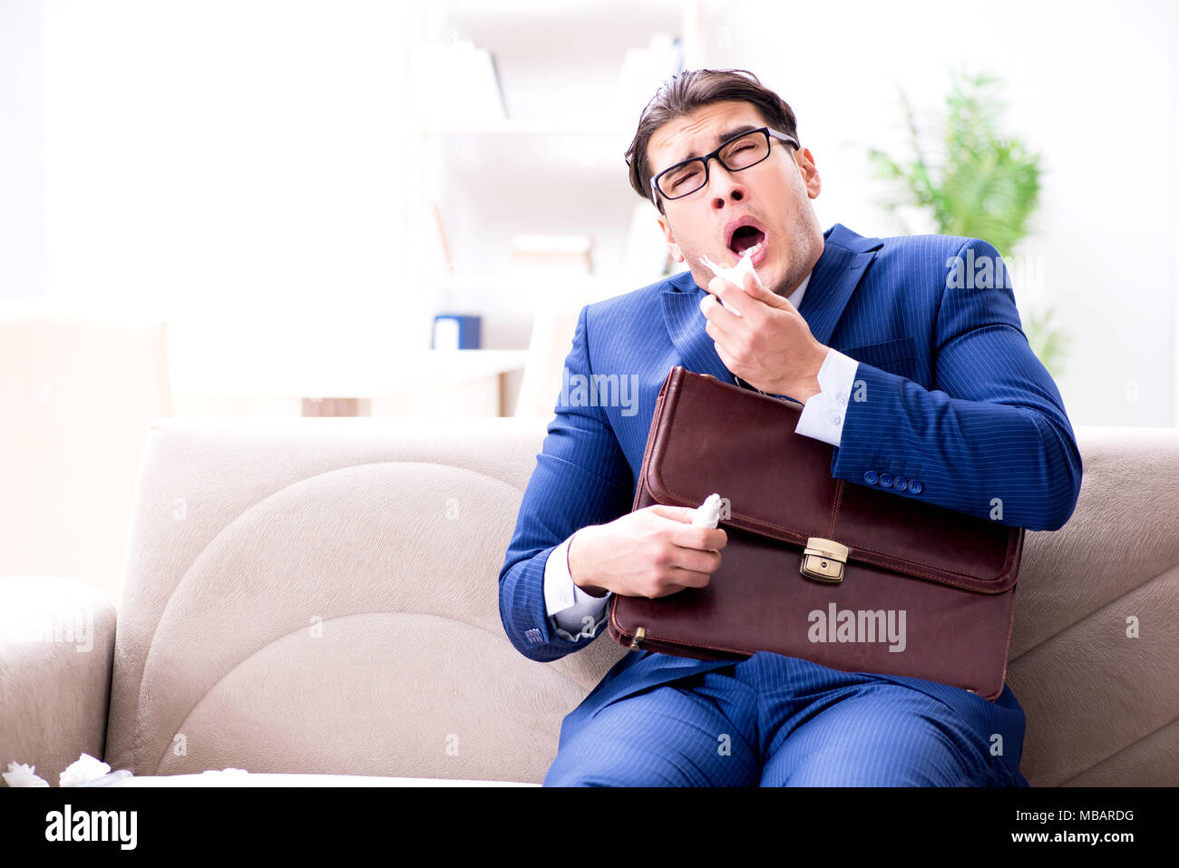 Sick employee staying at home suffering from flue Stock Photo - Alamy