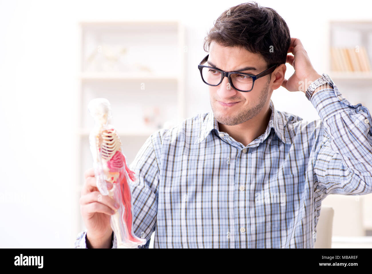 Medical student studing the skeleton Stock Photo - Alamy