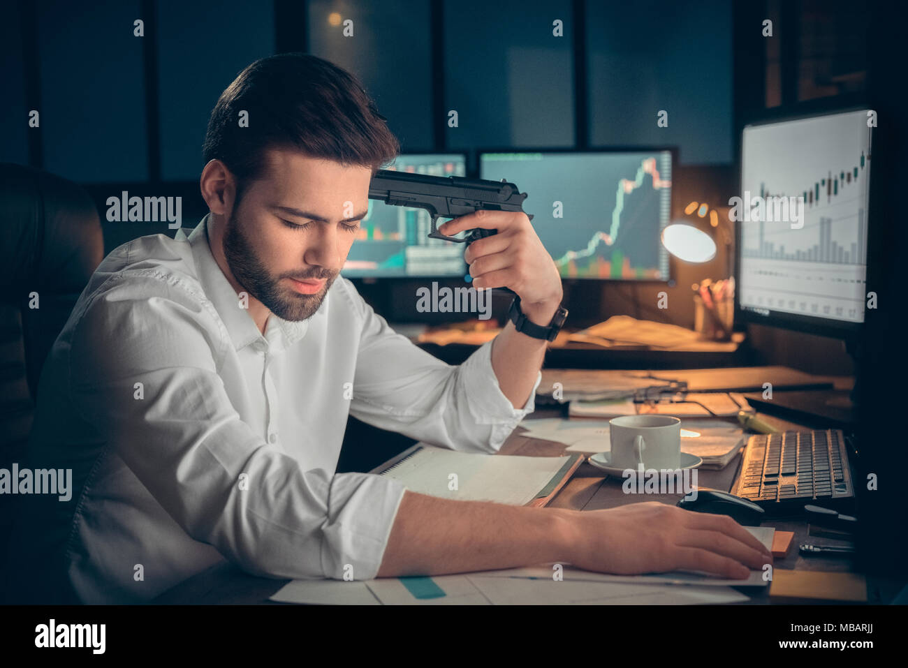 Businessman holding gun head hi-res stock photography and images - Alamy