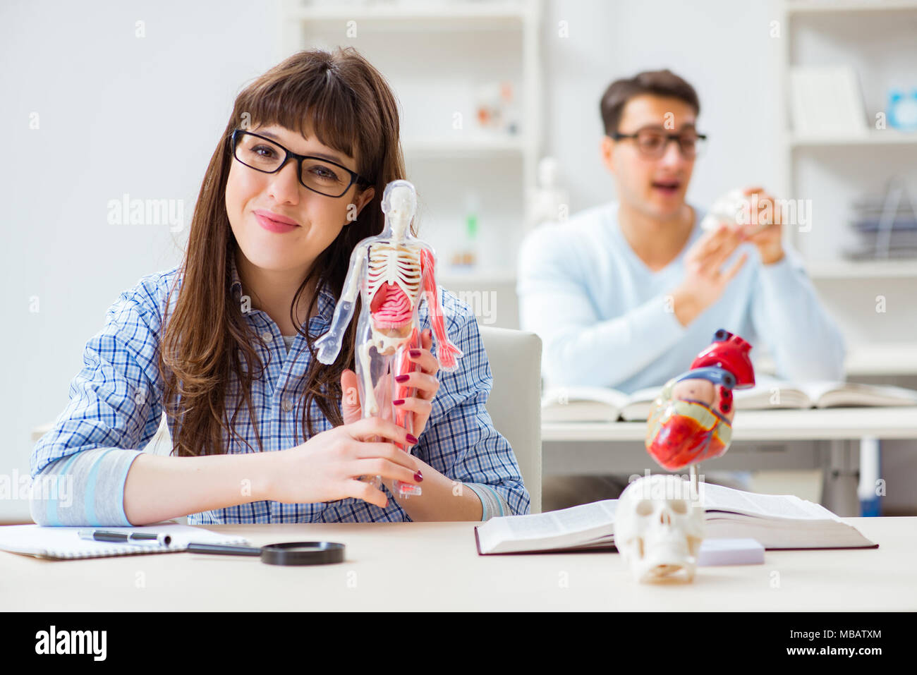 Two medical students studying in classroom Stock Photo - Alamy