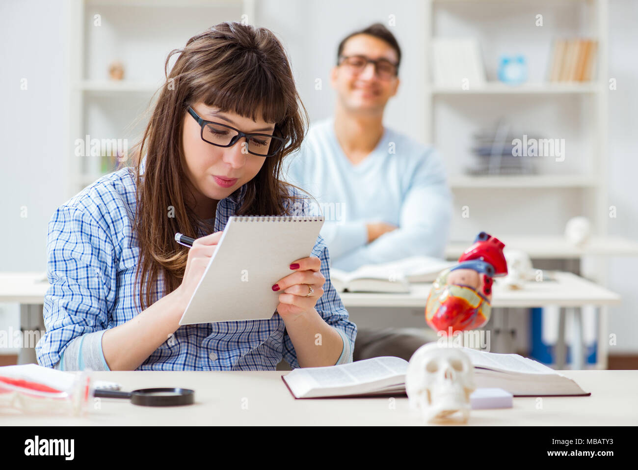 Two medical students studying in classroom Stock Photo - Alamy