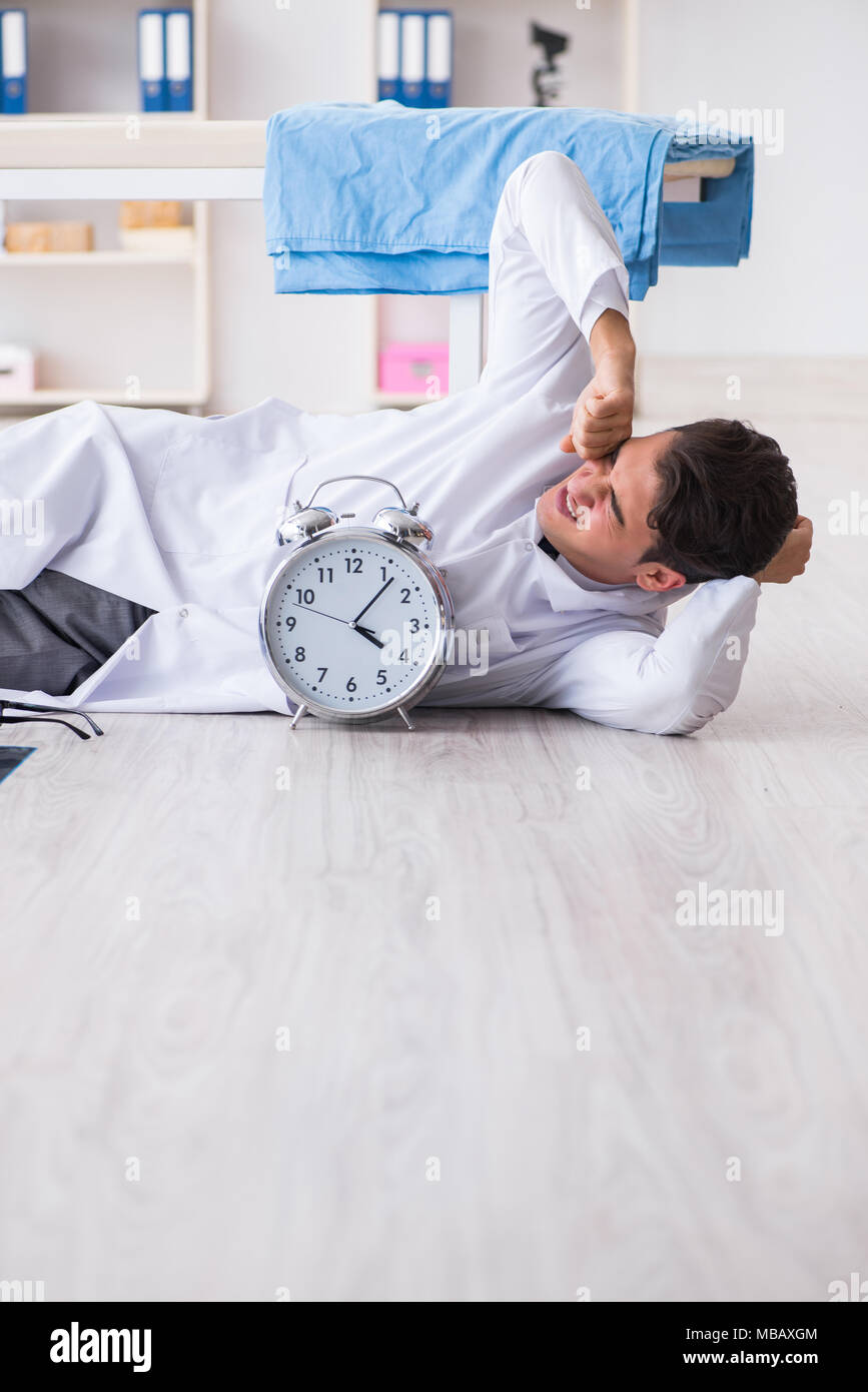 Sleepy doctor tired after long night shift Stock Photo - Alamy