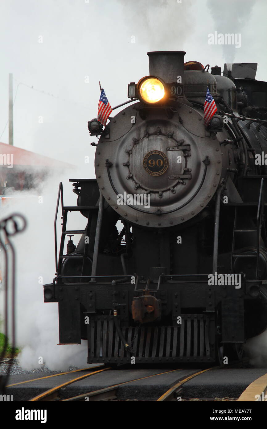 Steam locomotive pulling into a rail yard Stock Photo - Alamy
