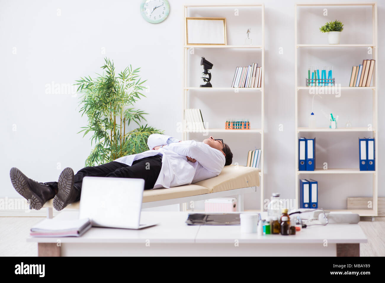 Doctor relaxing after complex surgery in hospital Stock Photo - Alamy