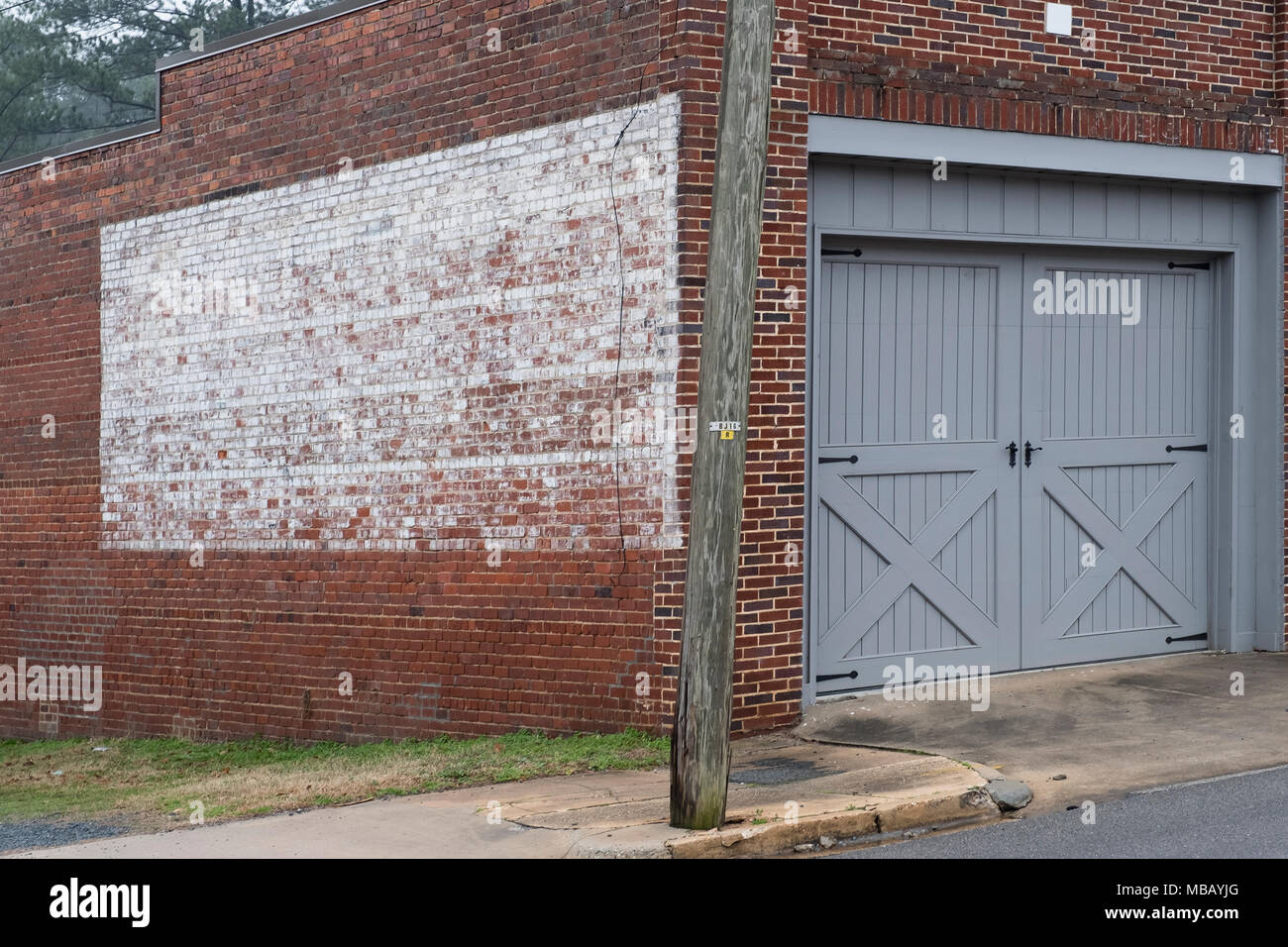 faded painted sign on rustic old brick wall texture store or building ...