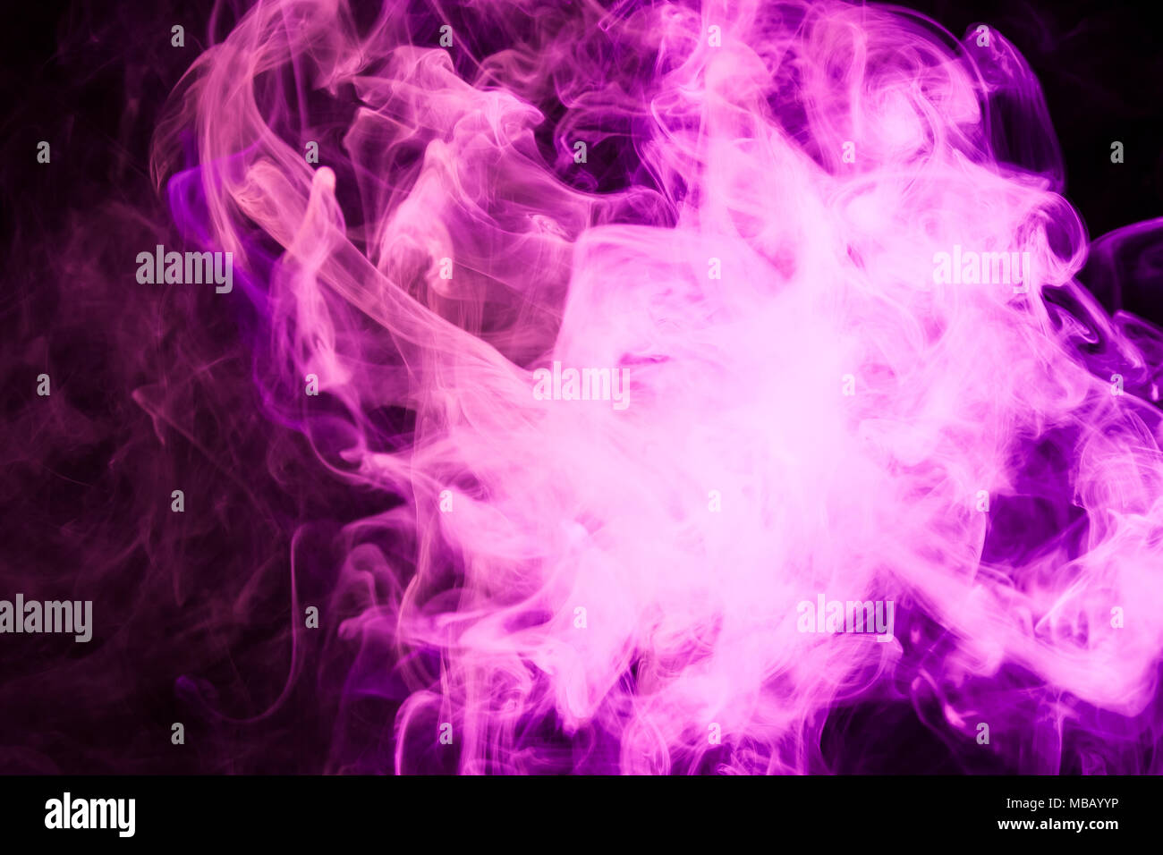 Pink and red smoke on black background Stock Photo - Alamy
