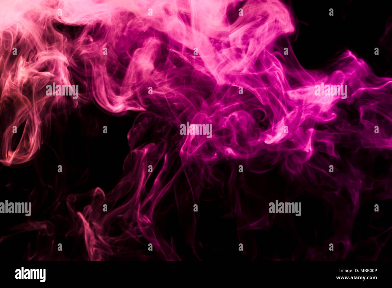 Colorful pink and red smoke on a black isolated background. Background ...
