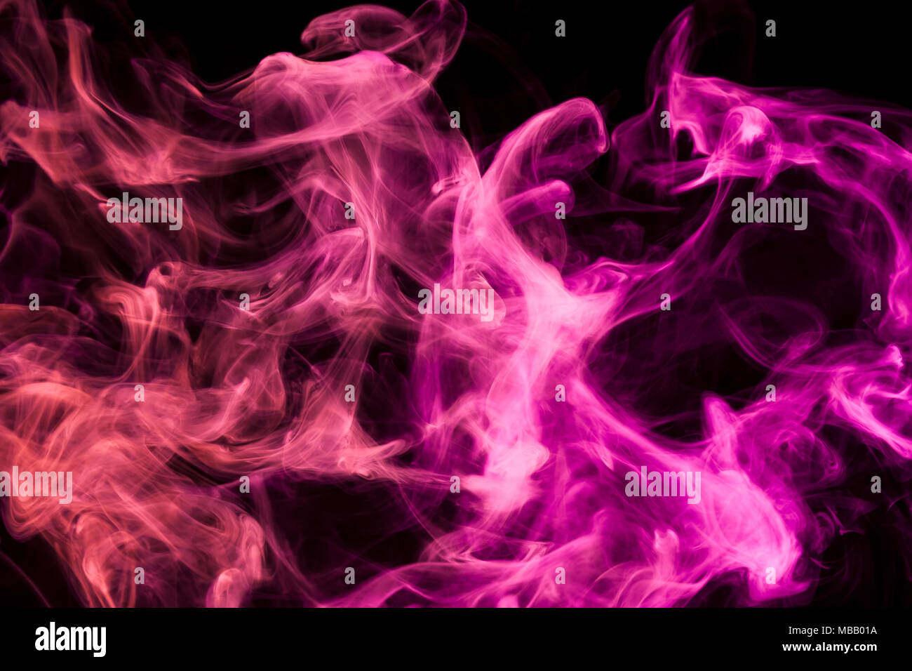 Colorful pink and red smoke on a black isolated background. Background ...