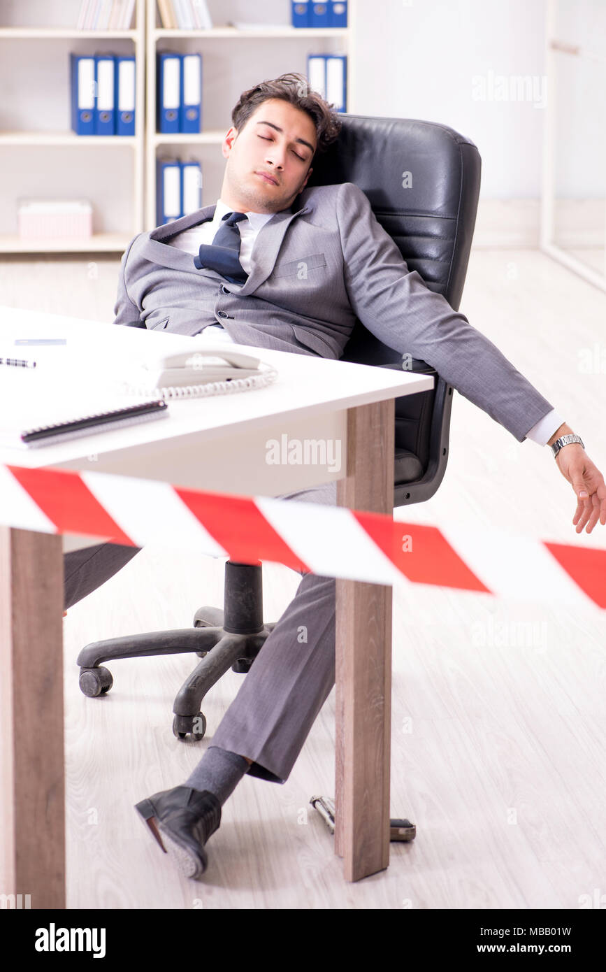 Dead businessman at this desk Stock Photo - Alamy