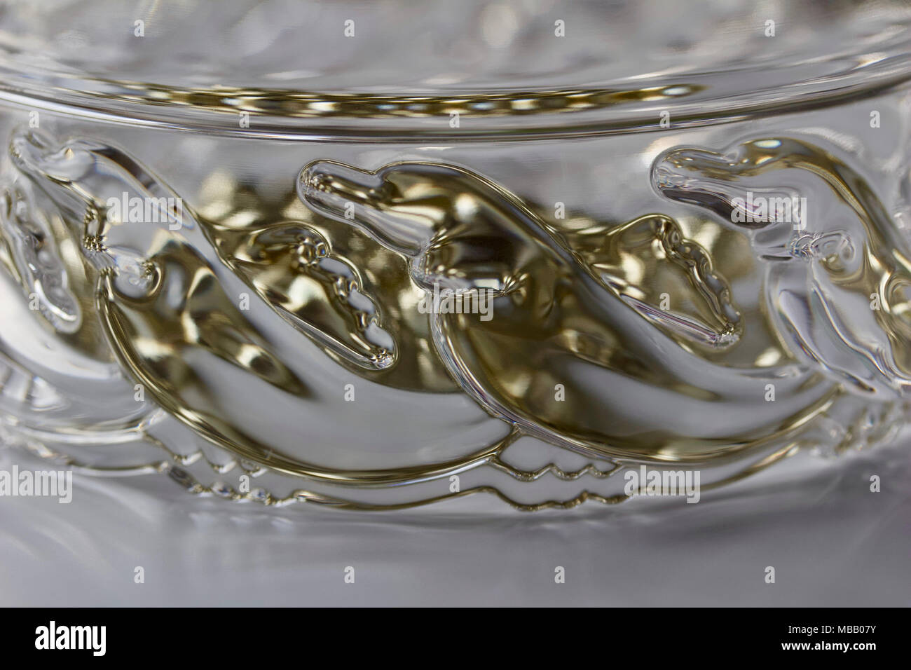 Macro view of beautiful dolphin designs carved into lead crystal ...