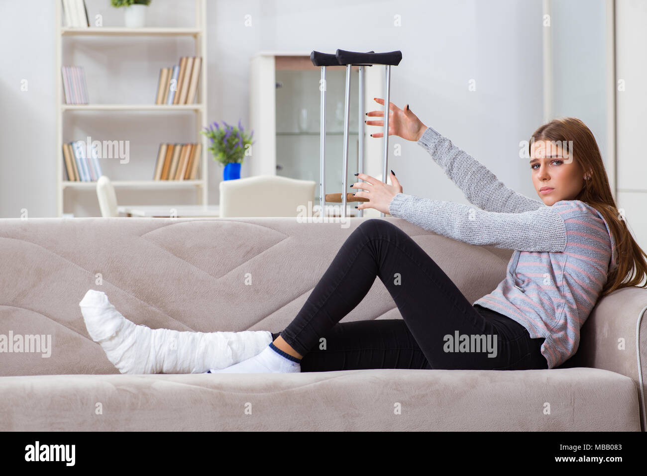 Young woman with broken leg at home Stock Photo - Alamy
