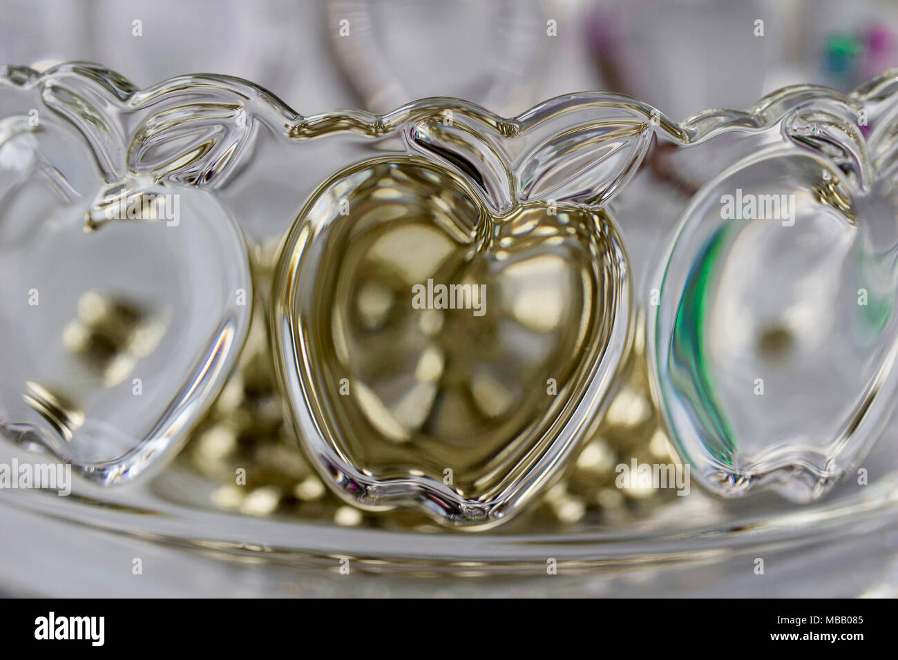 Macro view of beautiful apple designs carved into lead crystal ...