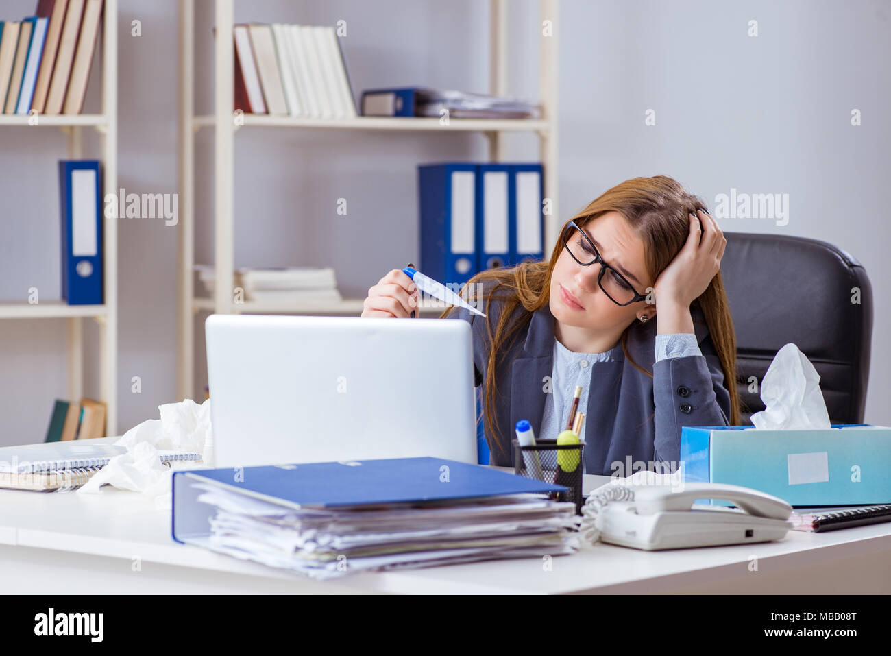 Businesswoman employee sick in the office Stock Photo - Alamy